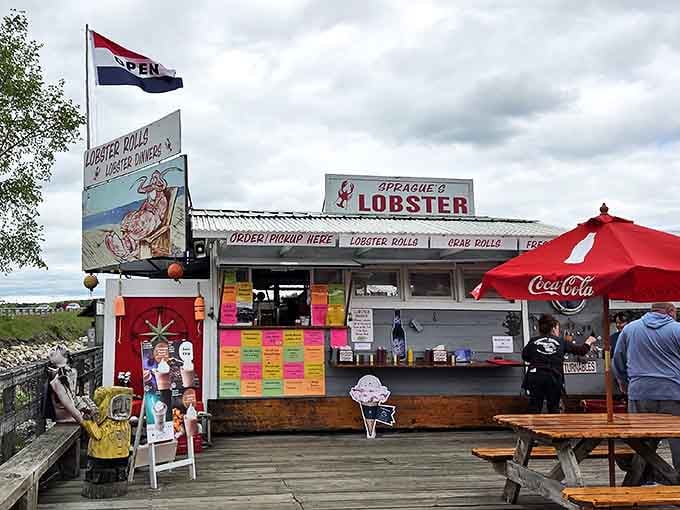 Flags flutter above this unassuming seafood sanctuary, where the colorful menu board promises treasures from the deep that would make Neptune himself jealous.