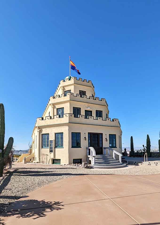 The Arizona flag flying proudly above a desert castle proves that sometimes reality is stranger than fiction.