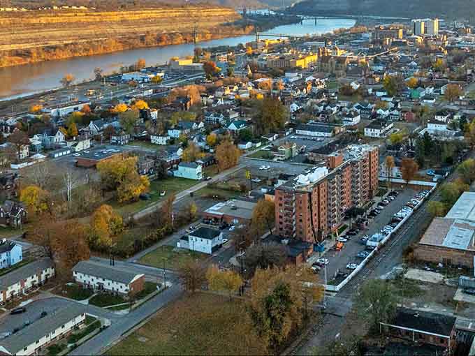 Golden autumn light bathes Steubenville's riverside neighborhoods, showcasing the town's perfect blend of urban and natural landscapes.