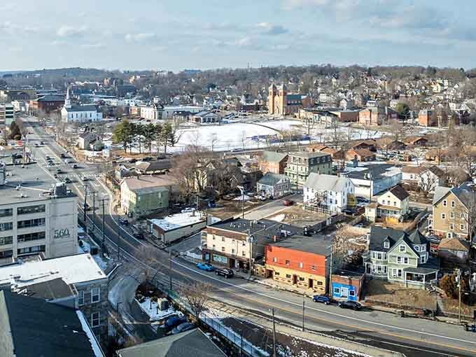 The town spreads across gentle hills, showing off its mix of residential charm and commercial practicality from above.
