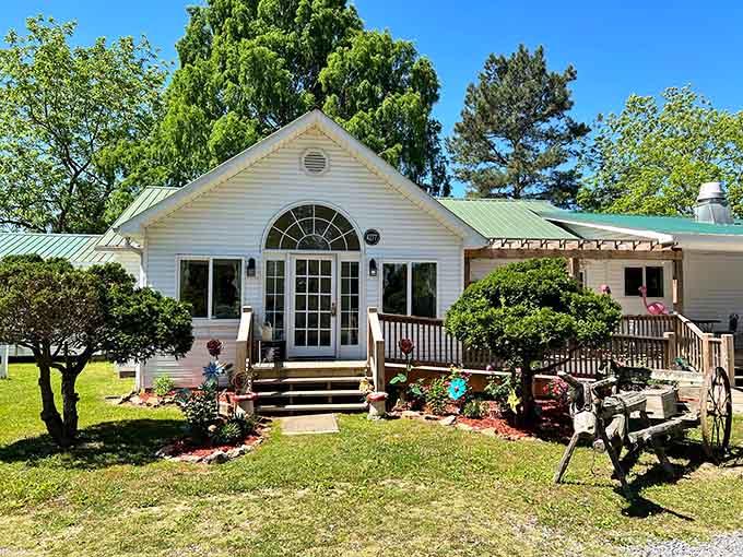 That charming white cottage with the green roof isn't a mirage, it's your gateway to Wonderland on a mountain.