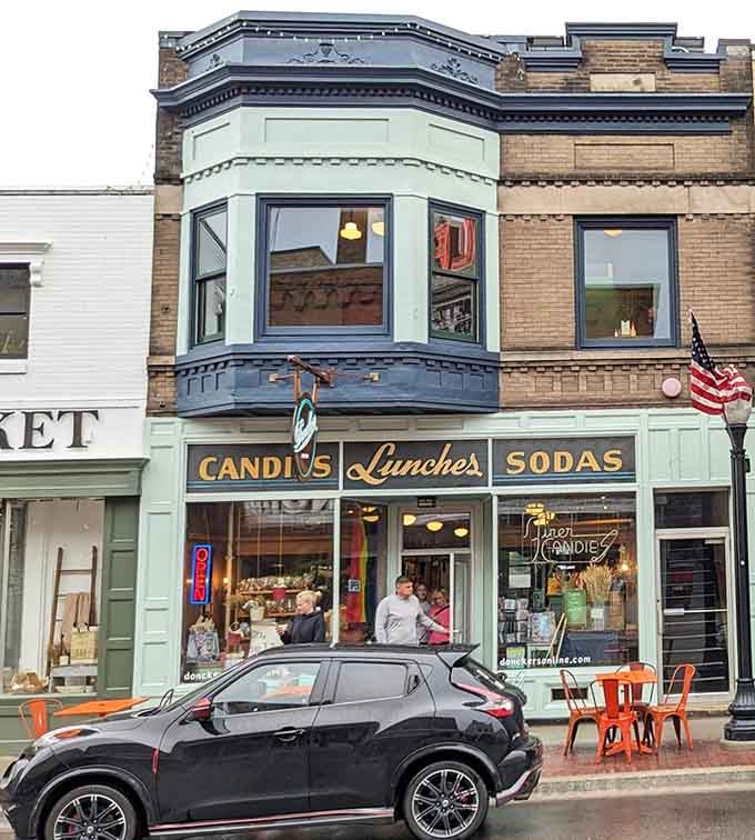 The classic exterior complete with "CANDIES Lunches SODAS" signage, basically Instagram before Instagram existed at all.