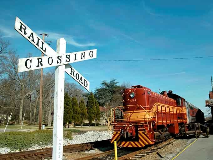 That striking red locomotive isn't just sitting pretty, it's your ticket to a slower, sweeter way of traveling.