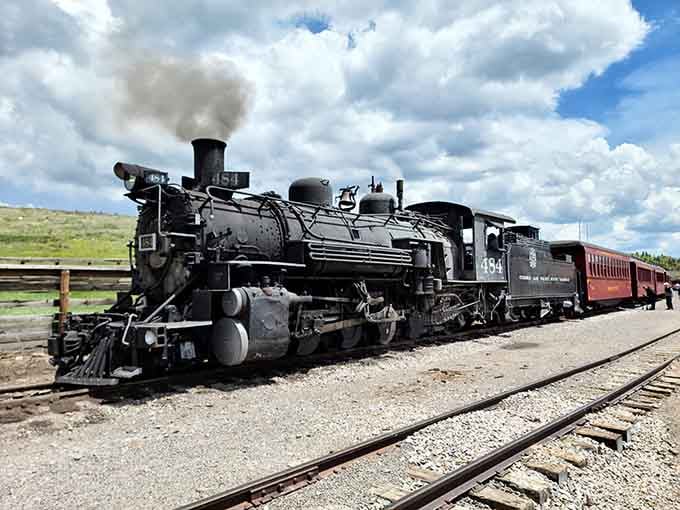 Steam billowing, wheels gleaming, and ready to transport you back to an era when travel meant something more than airport security lines.