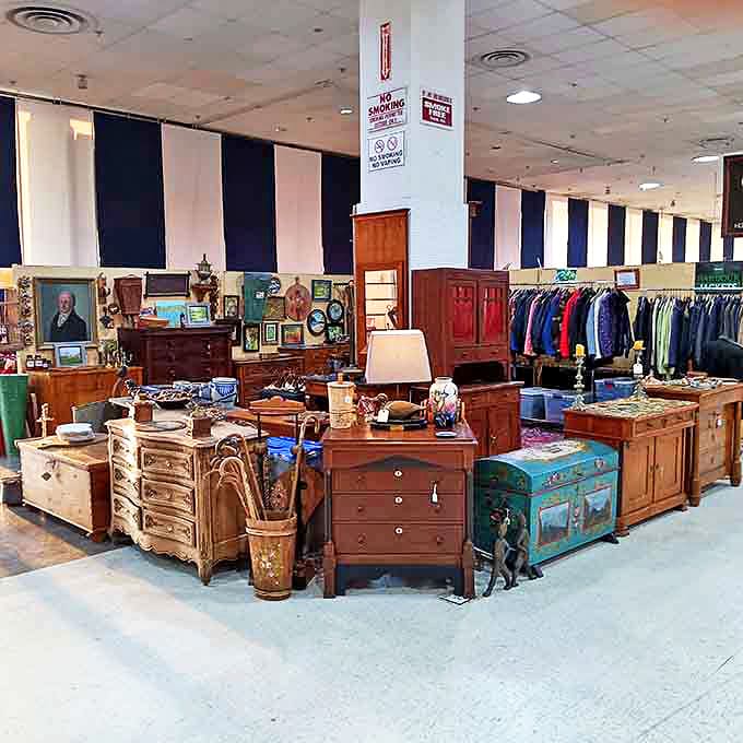 Furniture tetris at its finest! Wooden dressers, painted trunks, and vintage clothing create a playground for nostalgic souls hunting for that perfect conversation piece.