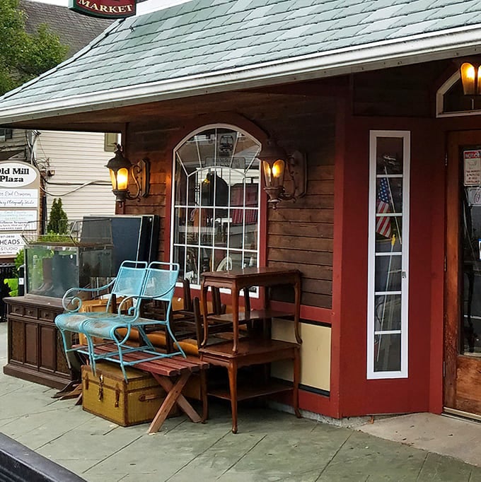 The outdoor display showcases furniture with stories to tell. That turquoise patio chair has probably hosted more interesting conversations than most modern living rooms.