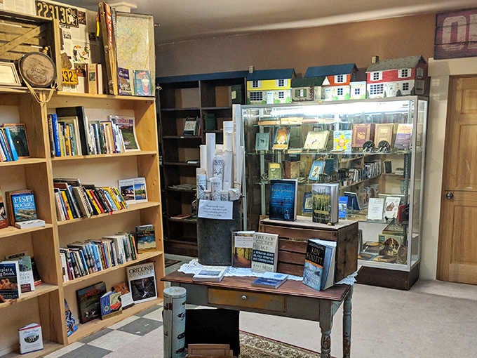 A literary treasure trove awaits! Vintage books and miniature dollhouses create a nostalgic corner where stories both written and imagined come together.