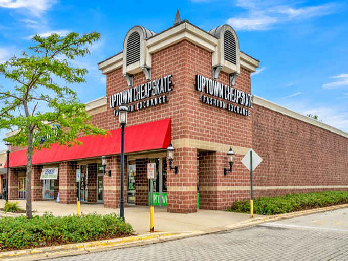 That bold red awning against classic brick architecture makes this fashion destination impossible to miss on your shopping adventures.