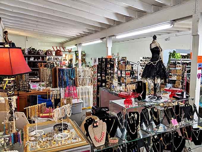 A jewelry vendor's paradise where vintage brooches and contemporary pieces coexist in a glittering testament to changing tastes.