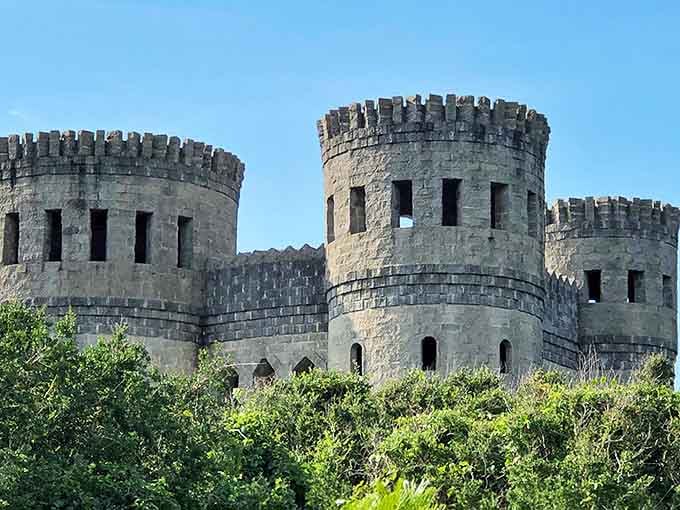 Medieval majesty meets Florida sunshine as Castle Otttis's imposing towers rise above the coastal greenery, looking like it was airlifted straight from the Irish countryside.
