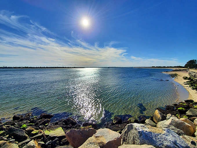 Where the Merrimack River meets the Atlantic at Salisbury Beach State Reservation, creating a sparkling confluence perfect for paddlers and anglers.