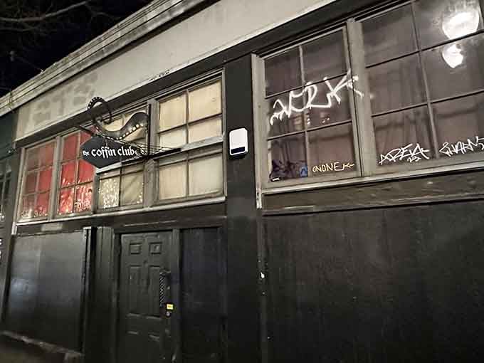 That coffin-shaped sign hanging outside isn't subtle about what awaits you below street level in Portland's Old Town.