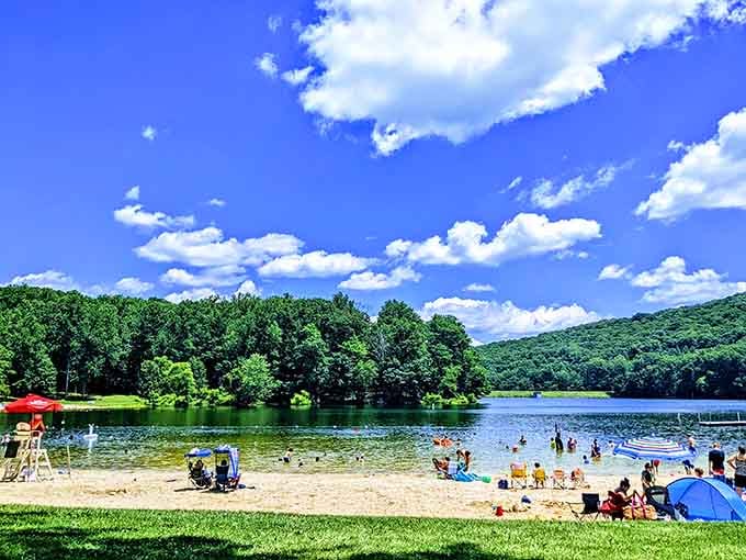 Paradise found: where crystal-clear waters meet sandy shores and mountains create the perfect summer backdrop.