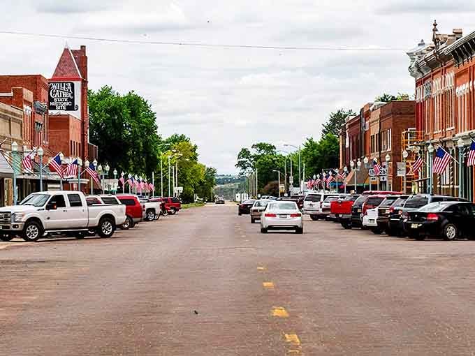 Main Street Americana at its finest! Red Cloud's downtown bursts with patriotic pride, the kind of place where flags flutter year-round and everybody knows your coffee order.