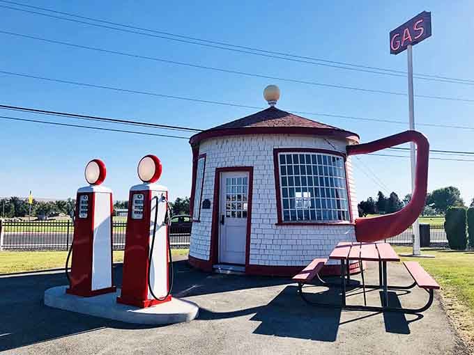 The Teapot Dome stands proudly beside vintage gas pumps, proving that political scandal can inspire delightful architecture.