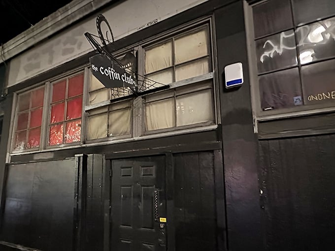 That coffin-shaped sign hanging outside isn't subtle about what awaits you below street level in Portland's Old Town.
