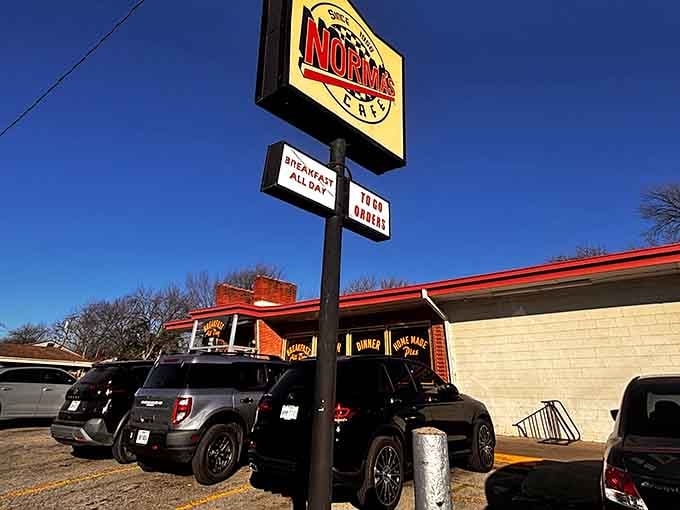 The sign stands like a beacon of hope in a world of green smoothies and deconstructed avocado toast.