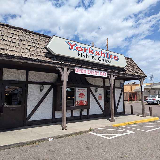 The Tudor-style facade of Yorkshire Fish & Chips stands like a British embassy on Denver soil, promising authentic flavors beneath its distinctive black-and-white timber framing.