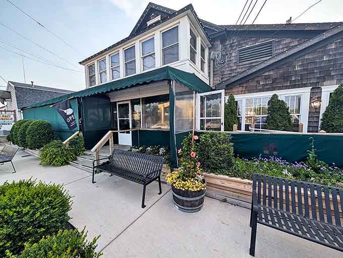 The weathered shingle siding and green trim of Lucky Bones whispers "come on in" like an old friend who knows all the best fishing spots in Cape May.