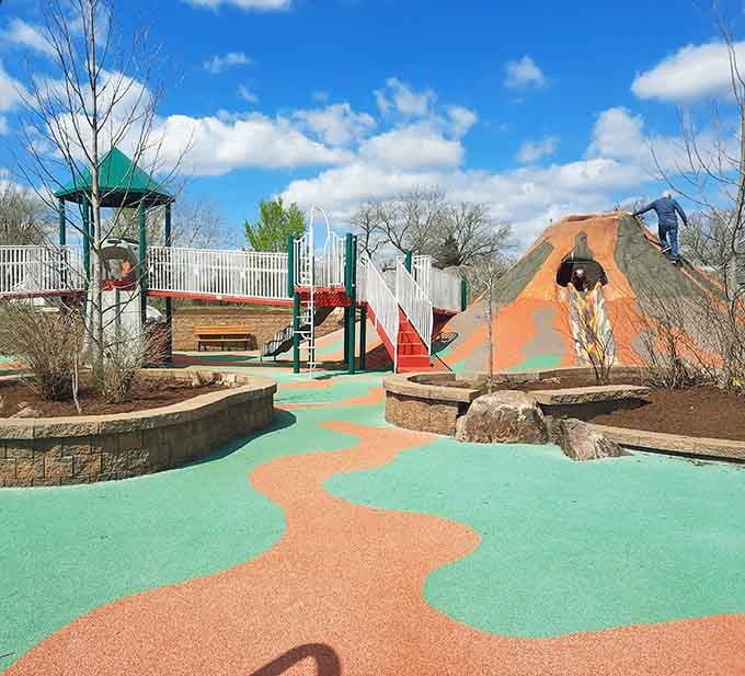 Those turquoise and coral pathways look like someone spilled a giant sherbet sundae across the playground.
