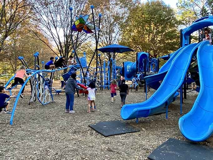 That electric blue playground equipment isn't just eye-catching, it's basically a kid magnet that works better than any screen.