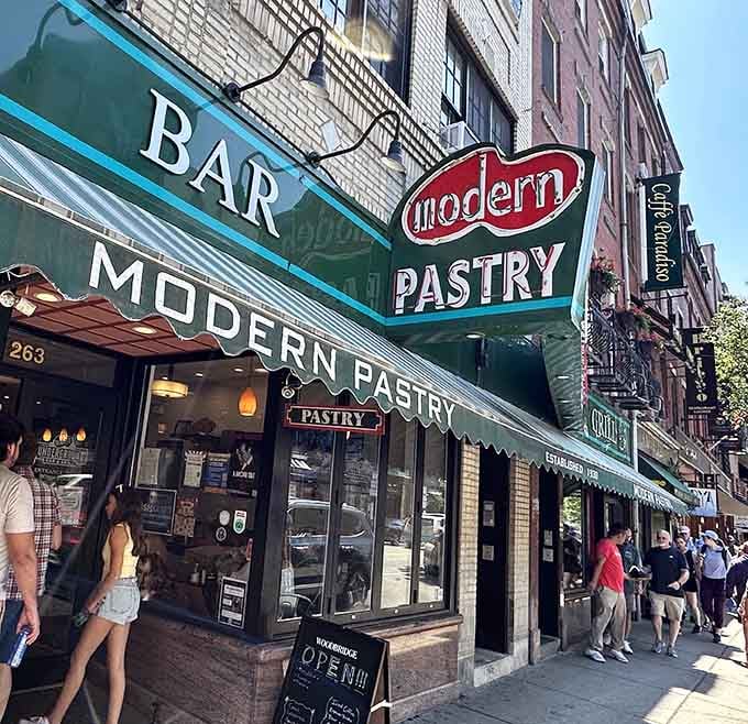 That green awning is your beacon to cannoli paradise, calling you home to Hanover Street's sweetest destination.