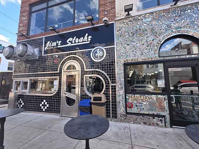 That checkered facade looks like a finish line, which is fitting since you've just won the cheesesteak lottery.