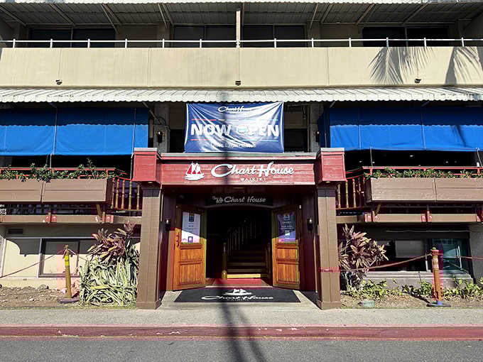 The welcoming entrance to Chart House Waikiki beckons like an old friend, promising seafood treasures and that legendary lava cake waiting just beyond those wooden doors.