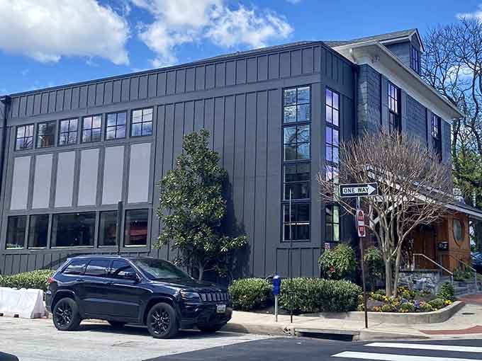Standing proudly on its corner lot, Mt. Washington Tavern's impressive two-story structure houses countless seafood dreams and bourbon-fueled conversations beneath its slate-gray exterior.