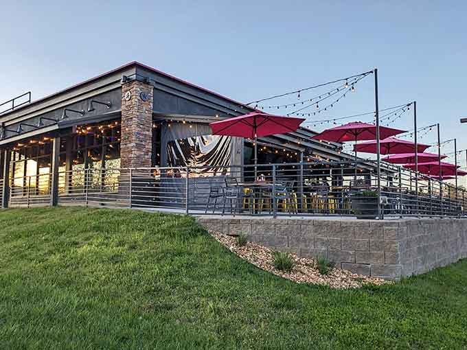 String lights and red umbrellas create the kind of outdoor dining atmosphere that makes you forget your troubles entirely.