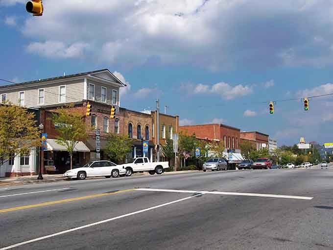 Tree-lined streets invite leisurely strolls through a downtown that hasn't forgotten what community actually means.