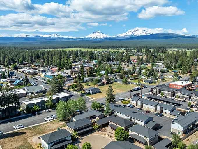 Those mountain peaks aren't just scenery, they're the three sisters who gave this town its name and its soul.
