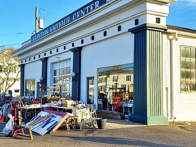 The iconic white facade with green trim of Clinton Antique Center beckons treasure hunters like a lighthouse for the nostalgic soul.
