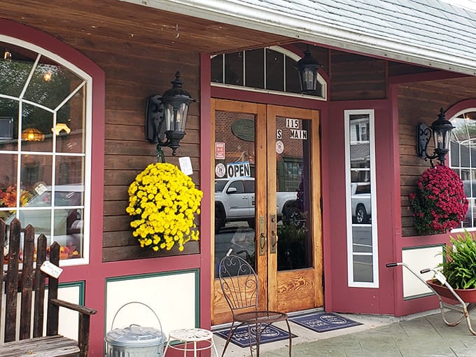 The welcoming facade of 5 & 10 Antique Market beckons with vibrant flower baskets and rustic charm&mdash;like your grandmother's house, if she collected everything cool from the last century.