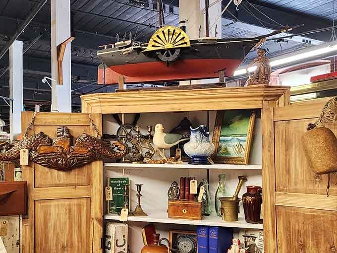 Ship ahoy! This magnificent model vessel perched atop a treasure-filled cabinet perfectly captures New Bedford's maritime soul. History sails above everyday treasures.