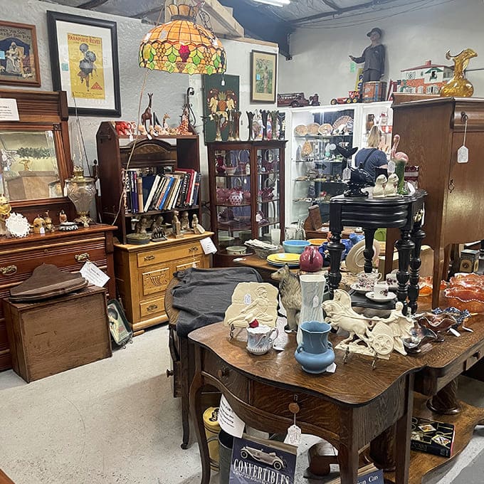 A cozy corner featuring a stunning Tiffany-style lamp, vintage furniture, and an eclectic mix of collectibles for every taste.