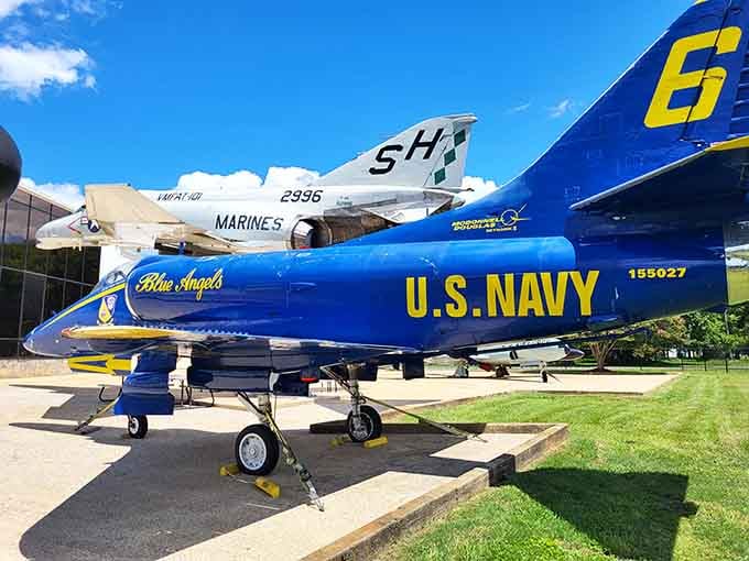 That Blue Angels Skyhawk isn't just posing for photos, it's reminding you why aviators are basically superheroes.
