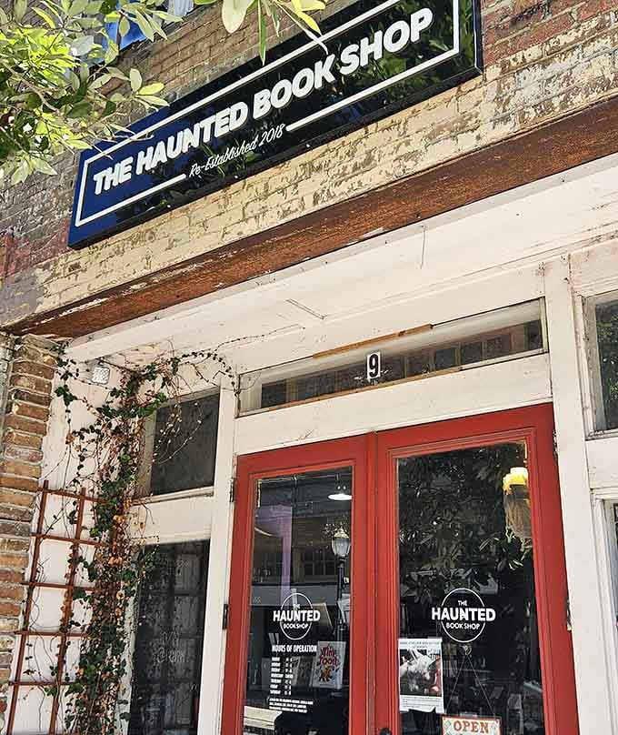The iconic blue sign against weathered brick promises literary adventures within. A name that intrigues and invites in equal measure.