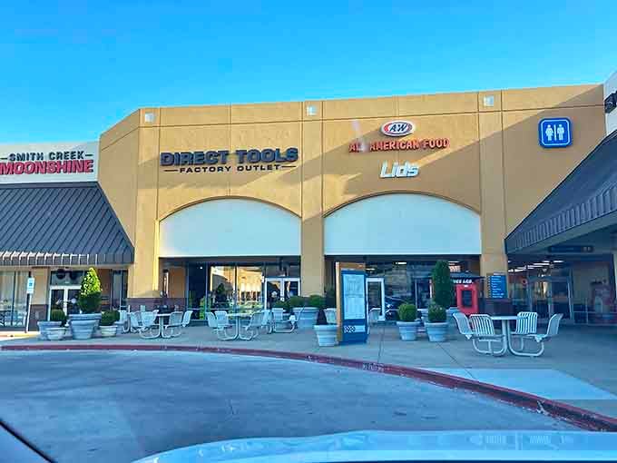 The tan fa&ccedil;ade of Tanger Outlets welcomes bargain hunters like a retail oasis in the Ozarks. Smith Creek Moonshine and Direct Tools stand ready for your wallet's surrender.