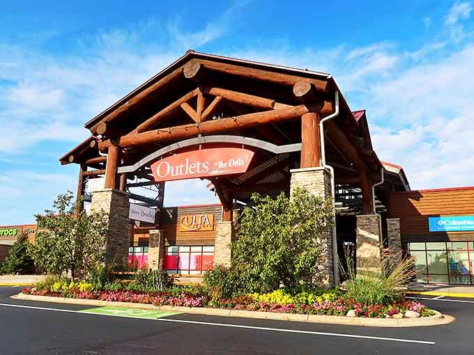 The grand entrance beckons shoppers like a rustic North Woods lodge that swapped pine-scented candles for designer handbags. Wisconsin's retail paradise awaits!