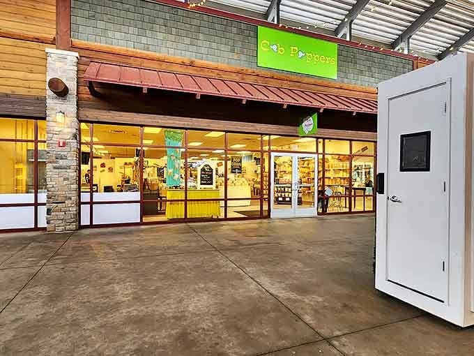 The bright storefront of Cob Poppers welcomes shoppers with its inviting glow, showcasing the family-friendly brands at Outlets at the Dells.