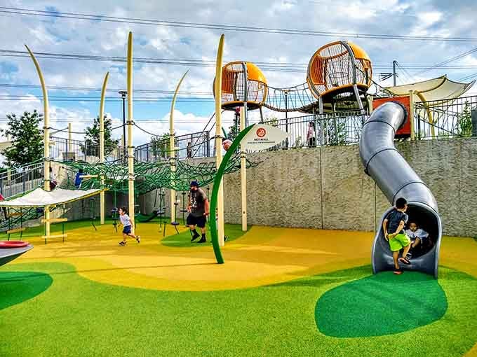 Modern playground design meets childhood dreams in this sprawling wonderland of slides, towers, and endless possibilities.