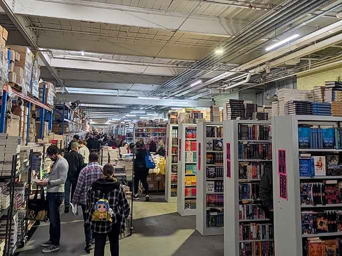 Rows of books stretch endlessly like a bibliophile's fever dream come to life in industrial splendor.