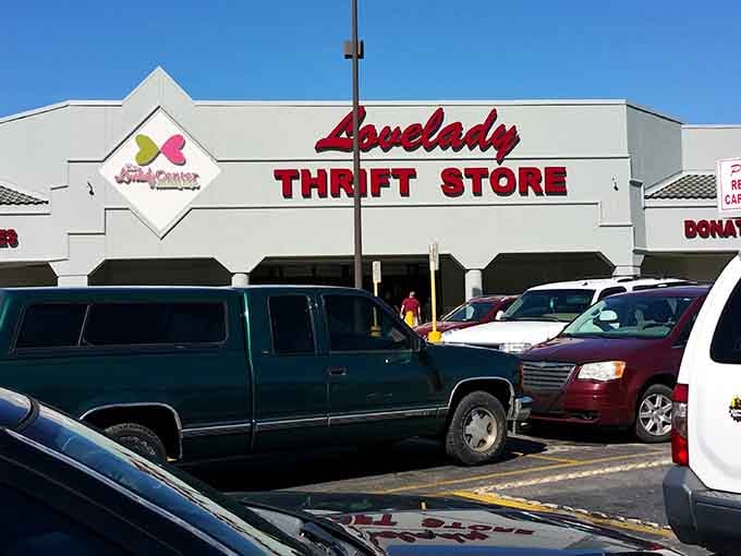 The iconic red Lovelady sign beckons bargain hunters like a retail lighthouse guiding ships to treasure-filled shores.
