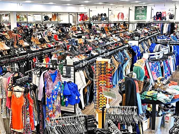 Organized racks filled with color-coordinated clothing create a shopping paradise where treasure hunters can browse without the typical thrift store chaos.