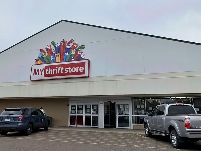 The colorful sign above the entrance promises treasures within, like a beacon for bargain hunters everywhere.