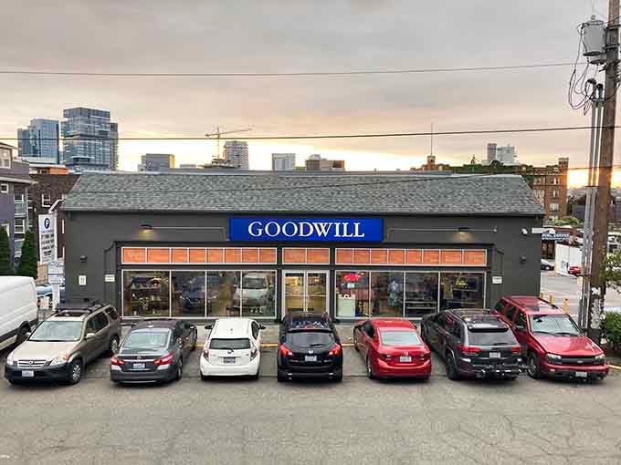 That blue Goodwill sign glows like a beacon for treasure hunters, promising adventures in secondhand shopping excellence.