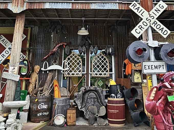 The front porch display at 1A Relics looks like a film set where Americana, nostalgia, and quirky treasures collide in rustic harmony.