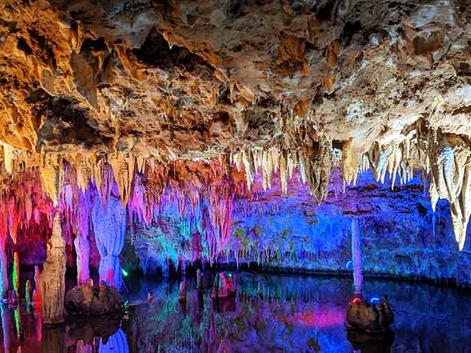 Neon hues illuminate the cave, transforming it into a vibrant, glowing masterpiece of nature.