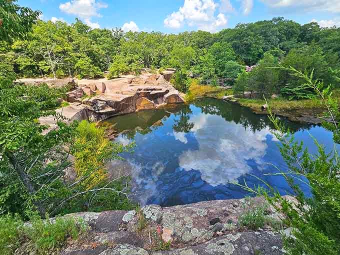 These pink granite giants have been perfecting their reflection game for 1.5 billion years, and honestly, they've nailed it.